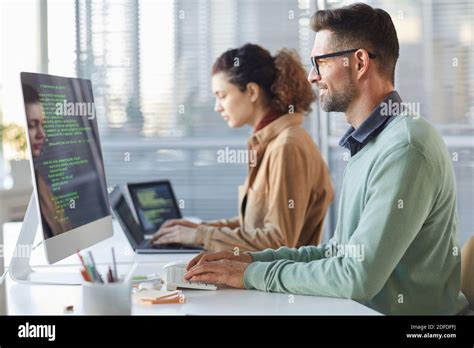 Programmers Typing Data Code Working On Project In Software Development