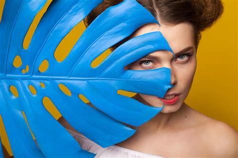 Premium Photo Sensual Model With Giant Leaf