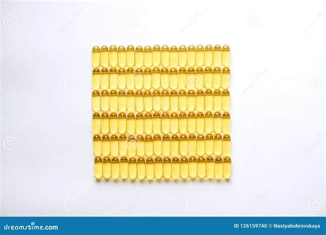 Yellow Nutritional Supplement Pills Full Of Omega 3 Fatty Acids Stock