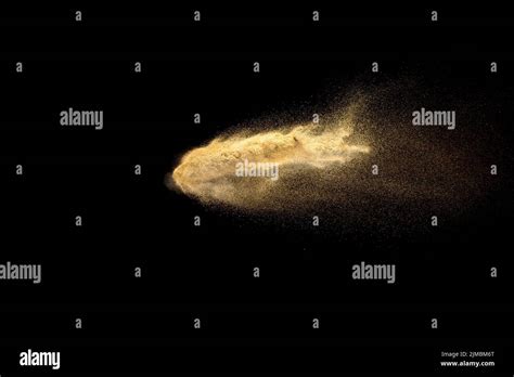 Abstract Sand Cloud Golden Colored Sand Splash Against Dark Background