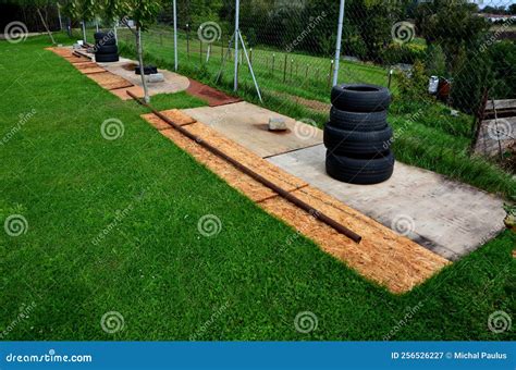 Covering Flower Bed With Boards Prepare The Soil And Get Rid Of