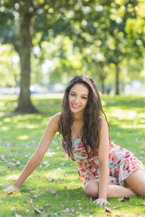 Stylish Cheerful Brunette Sitting On Grass Stock Image Image Of Hair