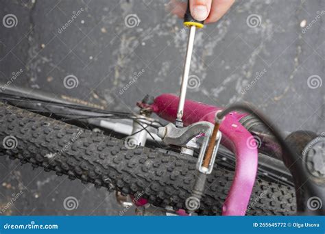 A Close Up Of Screwdriver Tool To Adjust And Repair Bicycle Crank