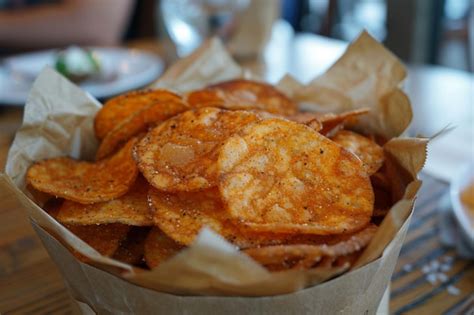Paper Bag Of Potato Chips Premium Ai Generated Image