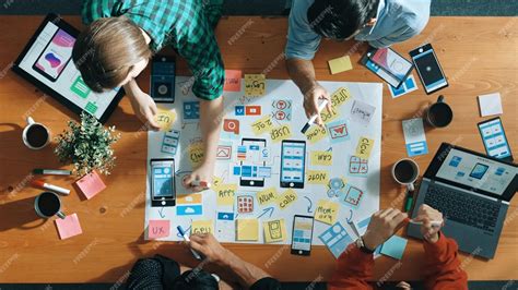 Premium Photo Top View Of Developer Team Sharing Ux Design By Using