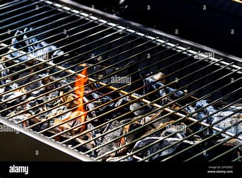 Barbecue Grill Pit With Glowing And Flaming Hot Open Fire With Red