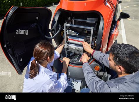 twizzy electric vehicle researchers work in two electric cars the