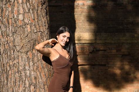 South American Woman Young And Beautiful Brunette With Brown Dress