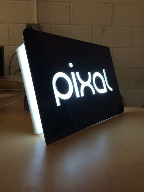 Face And Halo Lit Reception Desk Branding