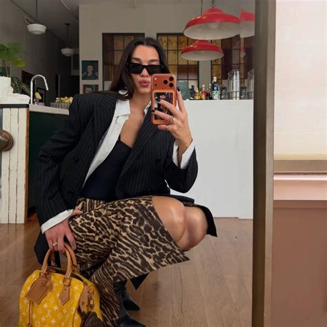 Dua Lipa Brings The Heat In An Asymmetrical Cheetah Print Skirt And