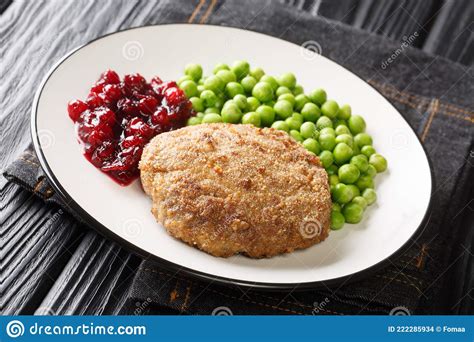 Swedish Luxurious Wallenbergare Veal Patties With Green Peas Closeup In