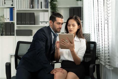 Premium Photo The Executive Is Using His Position Of Power To Grope