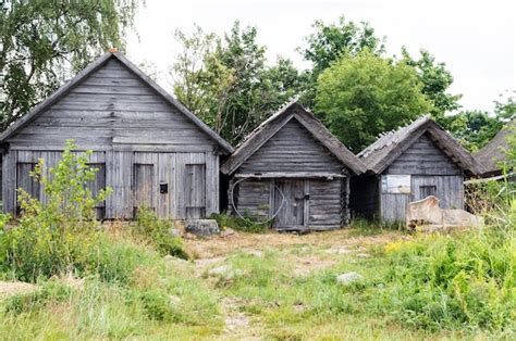 Premium Photo Built Structure On Field Against Trees