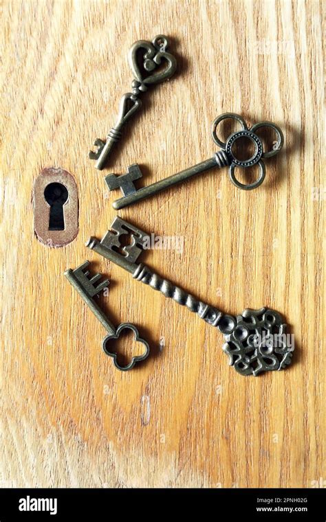 Set Of Various Old Keys Closeup Near Keyhole Stock Photo Alamy
