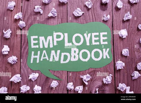 Sign Displaying Employee Handbookdocument That Contains An Operating Procedures Of Company