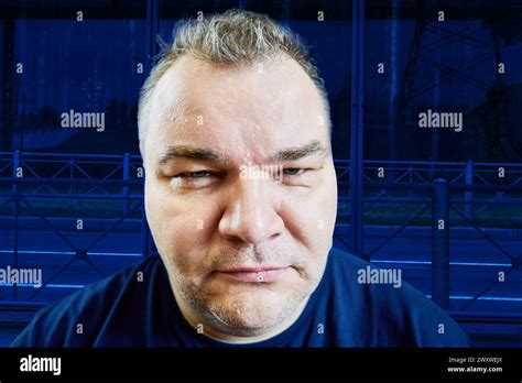 Feigned Severity On Face Of An Overweight European Man 47 Years Old