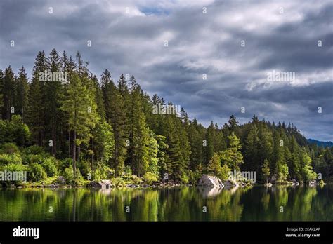 Lake Hintersee With Rocks And Trees In The Berchtesgaden Alps Germany