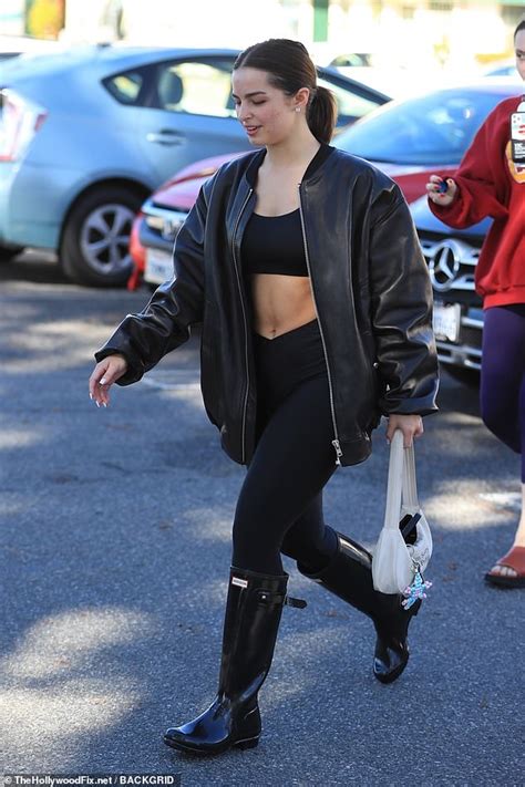 Addison Rae Showcases Her Toned Midriff In A Sports Bra And Metallic
