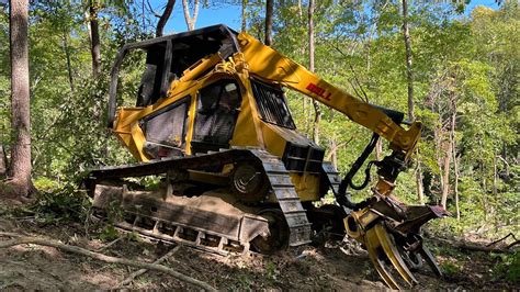 Bell Ultra T Track Feller Buncher Cutting And Topping Hardwood Timber