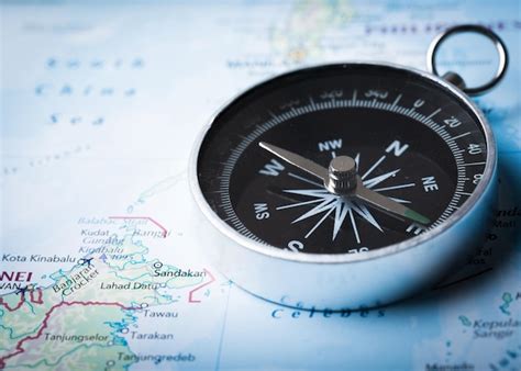 Premium Photo Metal Antique Compass On Background