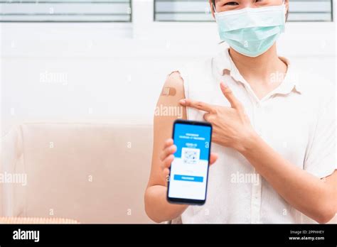 Woman Pointing To Adhesive Plaster On Arm Her Vaccinated And Showing