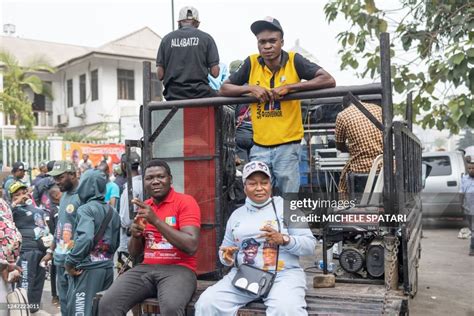 Supporters Of The All Progressive Congress Party Dance On The Bed Of