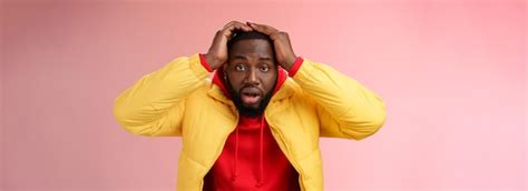 Free Photo Shocked Stupefied Young Africanamerican Bearded Man Grab