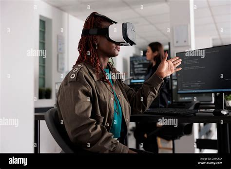 It Programmer Working With Virtual Reality Headset To Develop Server