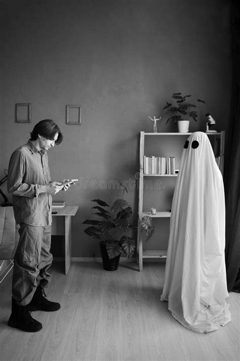 Sad Husband Clutches Photograph Of His Late Wife Unaware Her Ghost Is