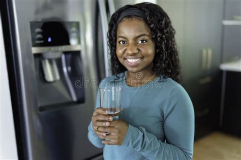 Young Woman On Front Of Fridge At Kitchen Stock Image Image Of