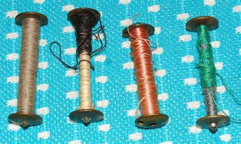 4 Vtg Antique Bullet Shuttle Bobbins Singer Sewing