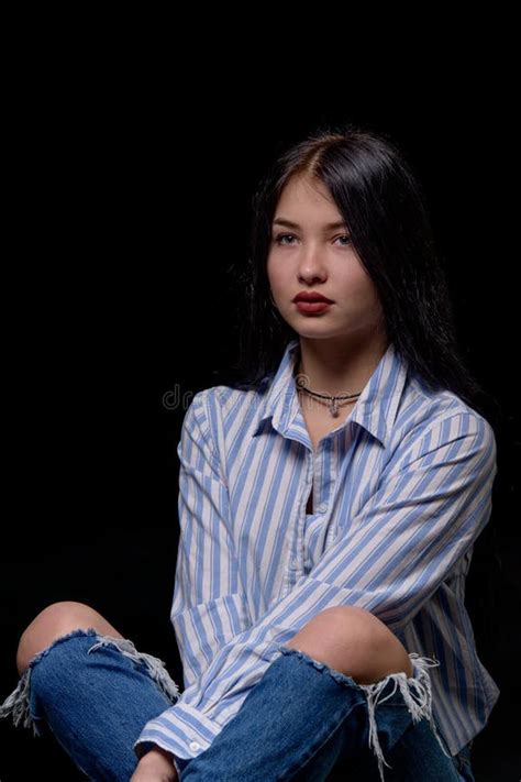 Studio Portrait Of A Young Girl Wearing A Striped Shirt 1 Stock Image