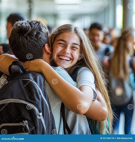 Overjoyed Students Reunite With A Heartfelt Hug In School Hallway Stock