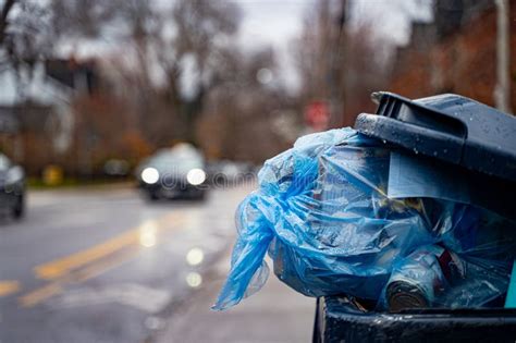 Overfilled Trash Bins And Rubbish Bags Full Of Garbage Stock Image