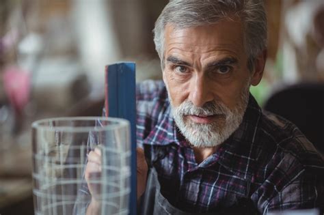 Free Photo Glassblower Working On A Glassware