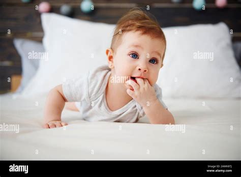Portrait Of Baby Lying On The Bed Stock Photo Alamy