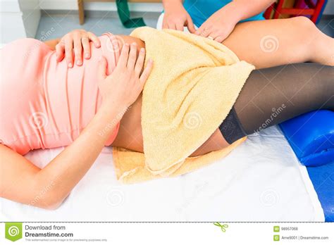 Physical Therapist Massages Pregnant Woman Wearing Compression S Stock