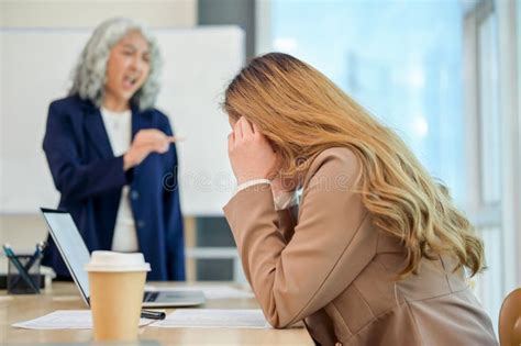 Stressed Asian Businesspeople Receiving Complaints From Their Boss