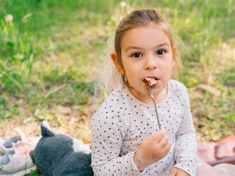 Premium Photo Close Up Of Cute Girl Blowing Nose