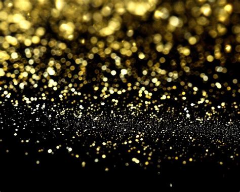 Premium Photo Gold Glitter Over Black Background