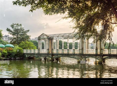 Wonderful Glass Bridge On Lake In Park Of Guilin In China At Sunset