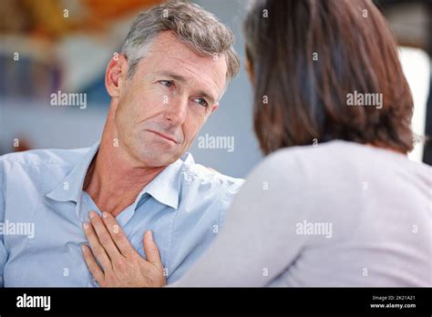 Hes Going Through A Mid Life Crisis Woman Consoling Her Husband At