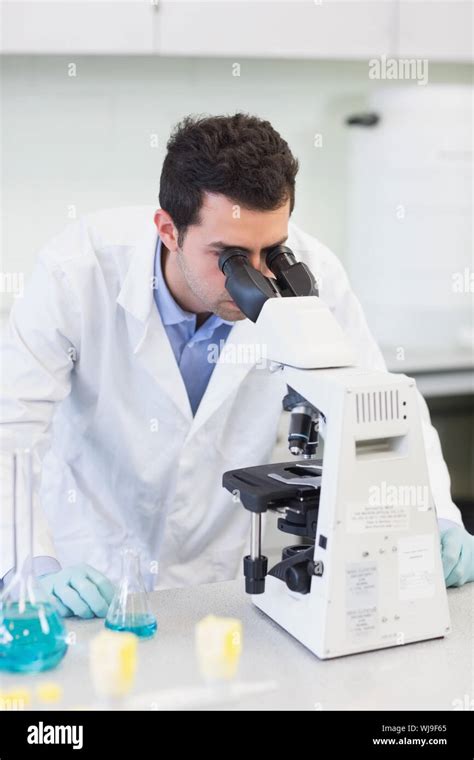 Male Scientific Researcher Using Microscope In The Laboratory Stock