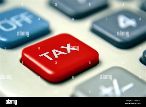 Tax Calculator With Red Button Stock Photo Alamy