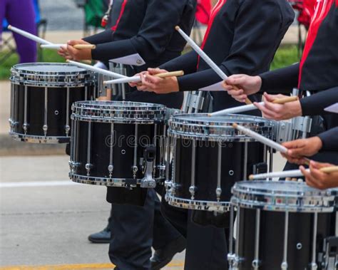 Bass Section Of A Marching Band Drum Line Warming Up For A Parade Stock