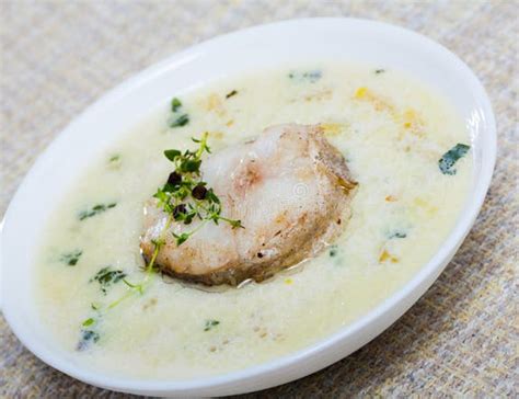 Boiled Creamy Soup With White Fish Pollock And Greens At Plate Stock