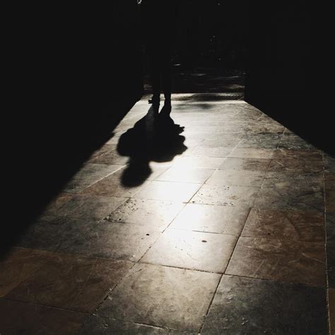 High Angle View Of Person Shadow On Floor Premium Photo