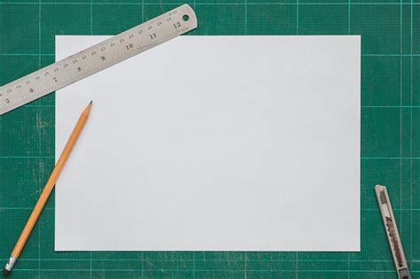 Premium Photo Blank Paper On Old Green Cutting Mat Background With