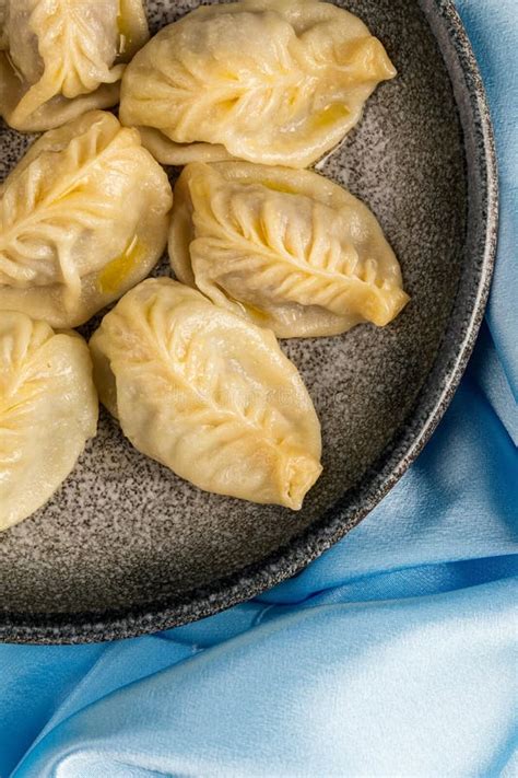 Russian Dumplings Pelmeni With Cooking In Hot Water White Plate With