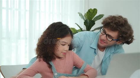 Father Explain Programing System While Pointing At Laptop Screen